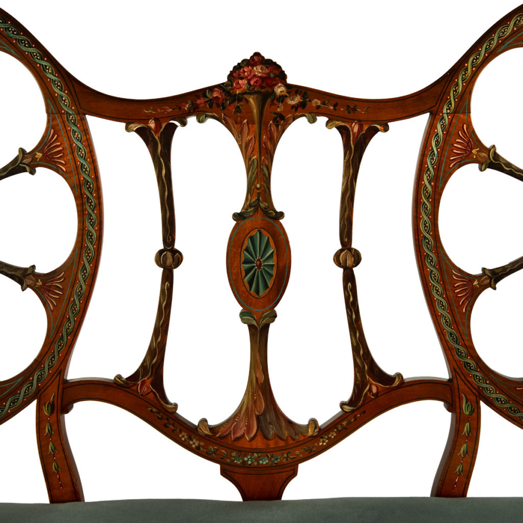 A late Victorian satinwood wheel back settee in the Chippendale style ...