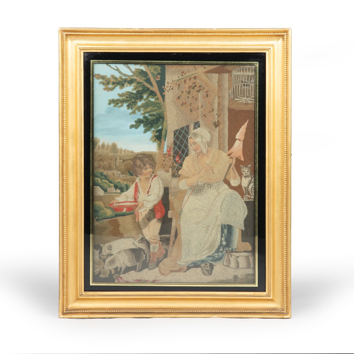 A fine Regency silkwork picture of The Industrious Cottage Wife after ...